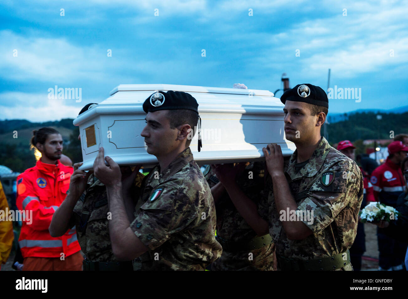 Amatrice, Italy. 30th Aug, 2016. Soldiers carry the coffin of a ...