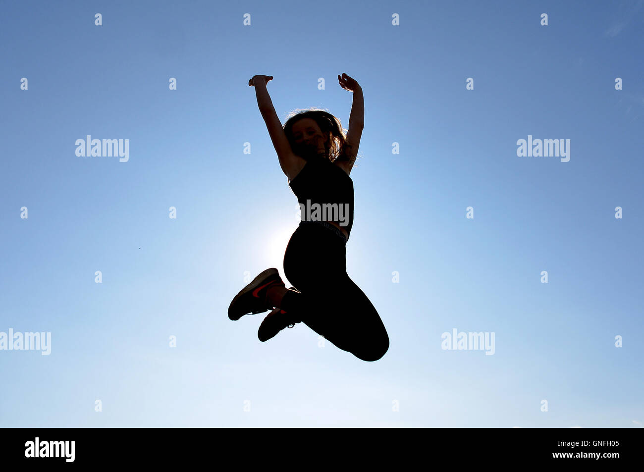 Children jumping in the sun Stock Photo - Alamy