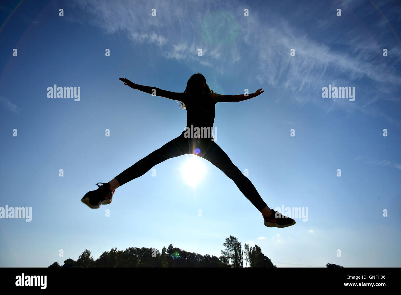 Children jumping in the sun Stock Photo - Alamy