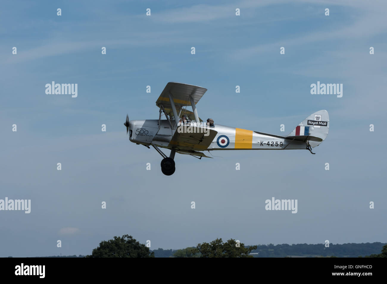 Royal Mail flew a vintage Tiger Moth, carrying a symbolic bag of mail ...