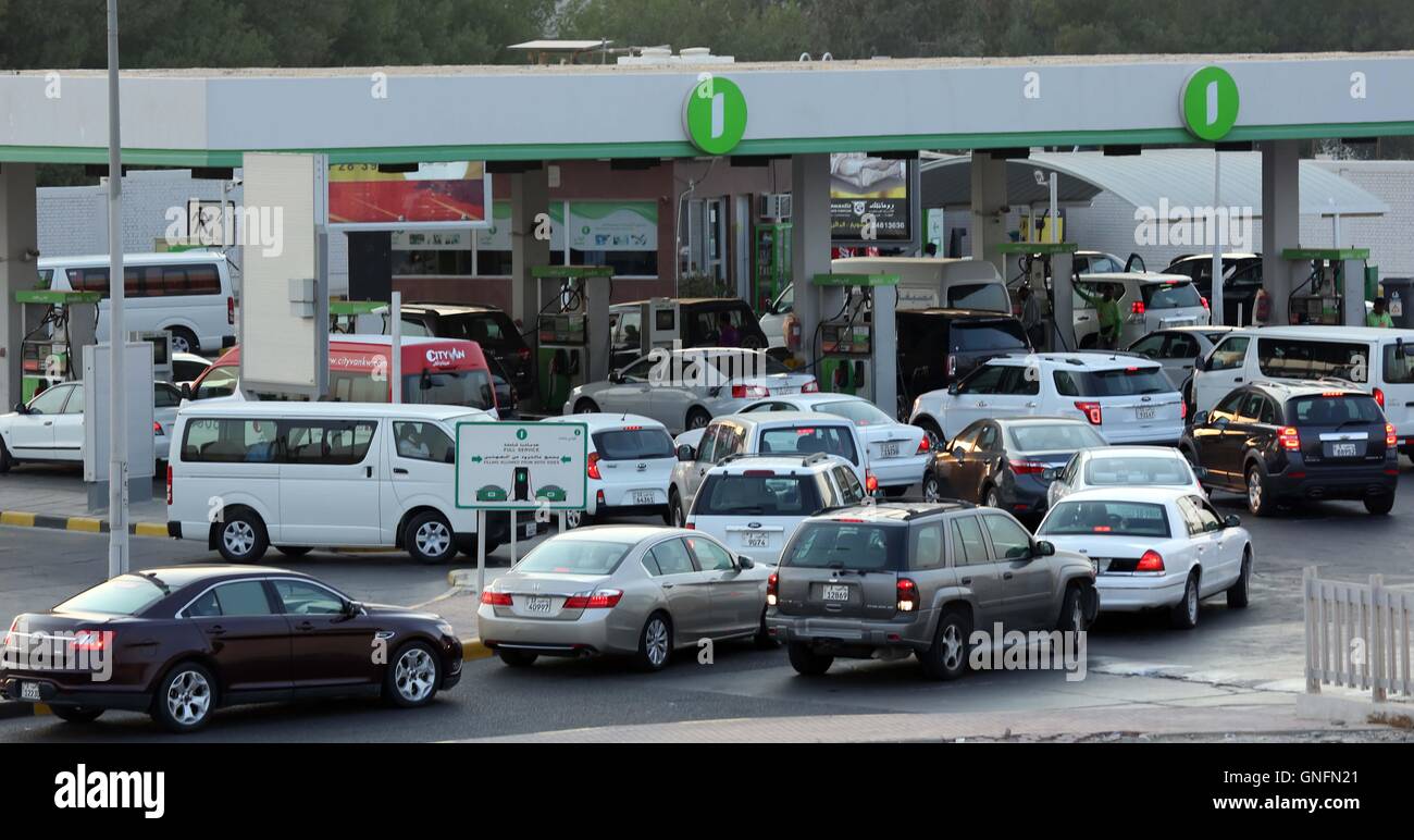 Kuwait City. 31st Aug, 2016. Cars wait in queue at a petrol station in ...