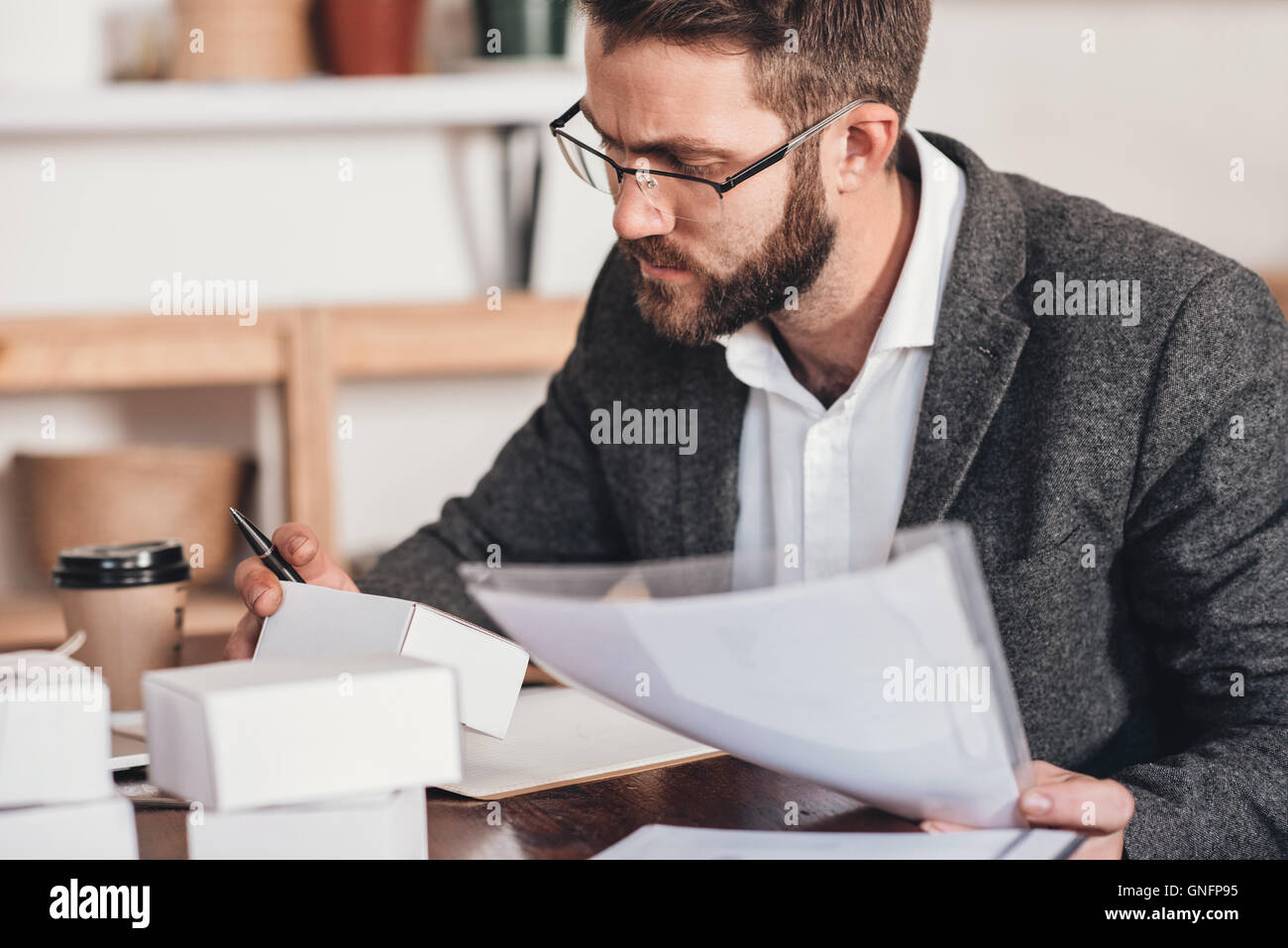 Going over today's shipments Stock Photo - Alamy
