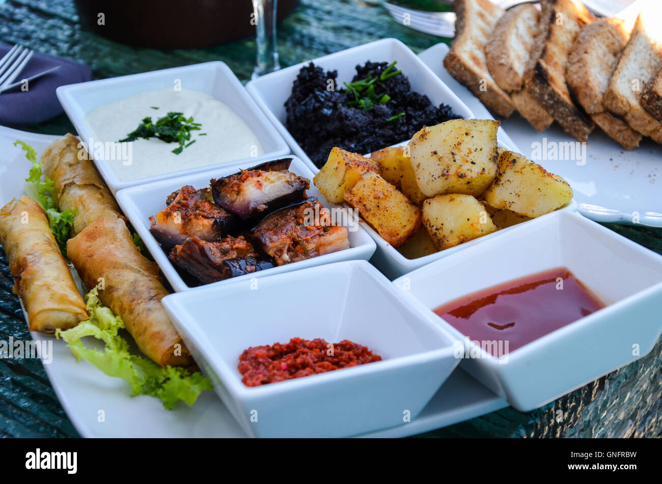 Moroccan tapas and spring rolls Stock Photo - Alamy