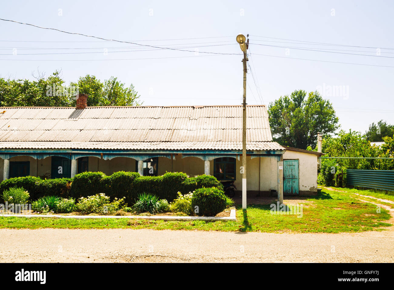 Rural house with tiled roof and garden Stock Photo - Alamy