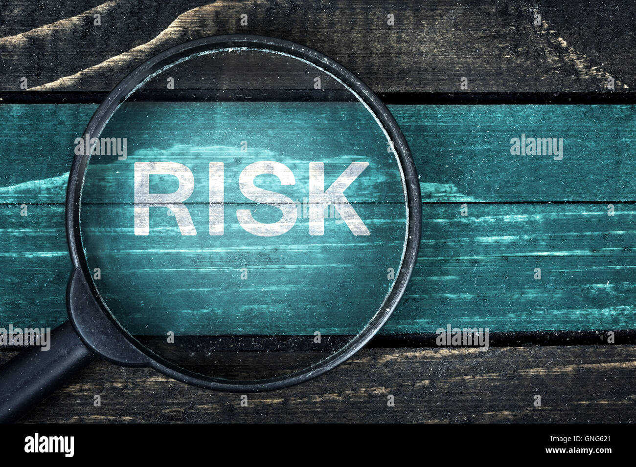 Risk text painted and magnifying glass on wooden table Stock Photo - Alamy Risk text painted and magnifying glass on wooden table Stock Photo - Alamy
