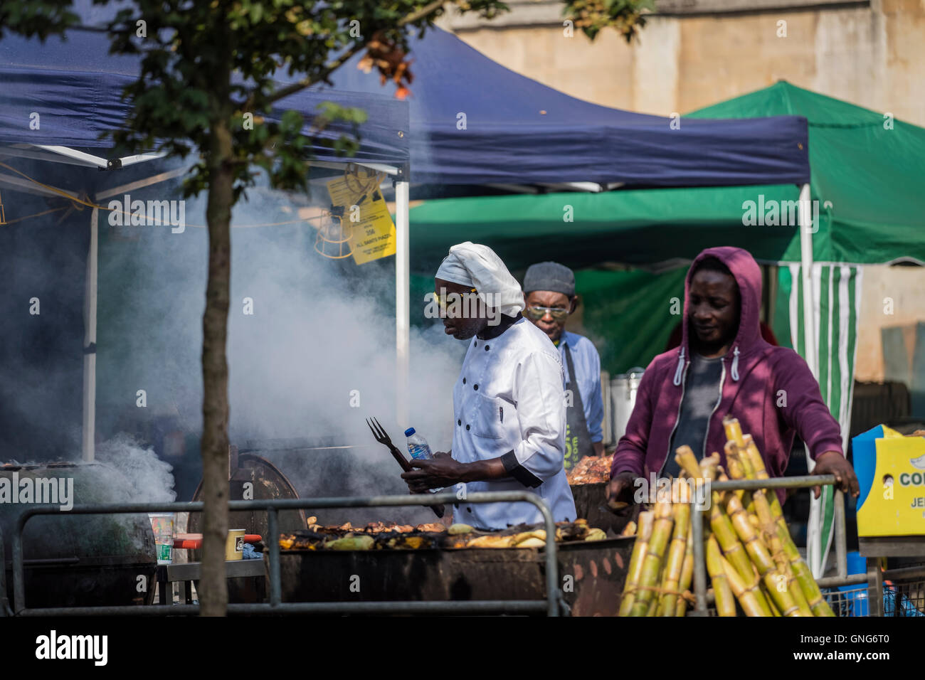 Smoke at a barbecue stall getting ready at the Notting Hill Carnival ...