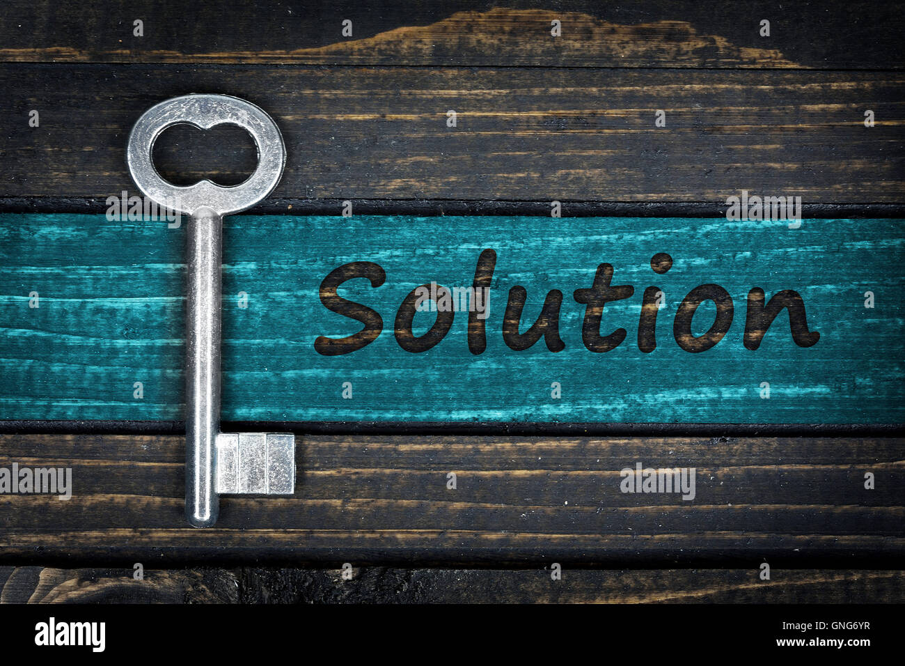 Solution word and old key on wooden table Stock Photo - Alamy
