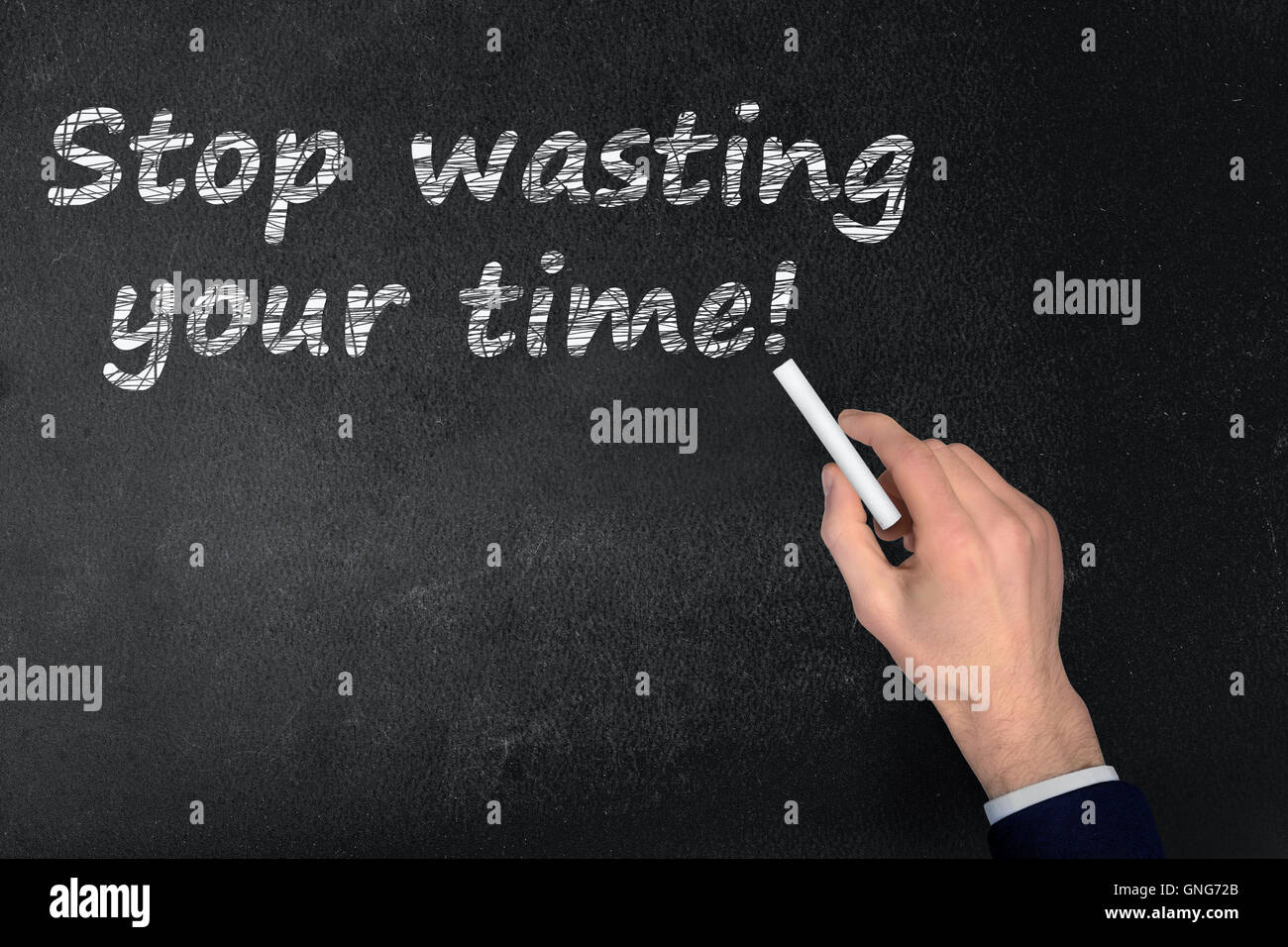 Stop wasting your time text write on black board Stock Photo - Alamy