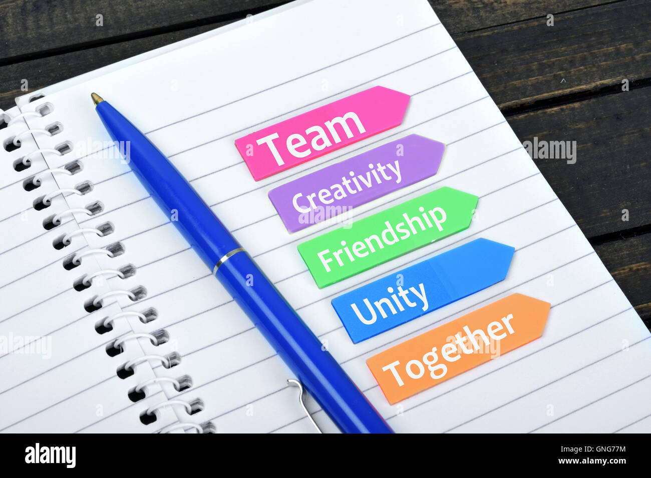 Teamwork values text on sticky colorful arrows Stock Photo - Alamy