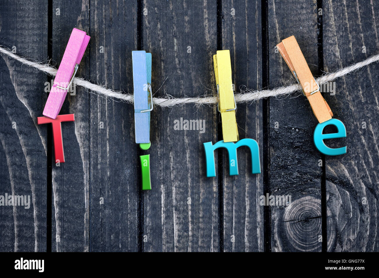 Time word hanging on clips and wooden wall Stock Photo - Alamy