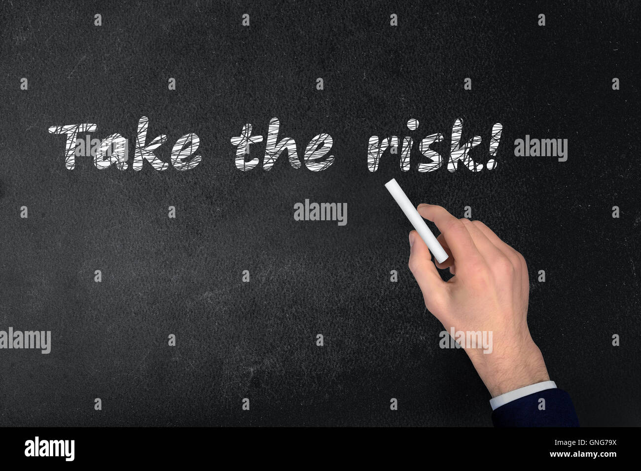 Take the risk text write on black board Stock Photo - Alamy
