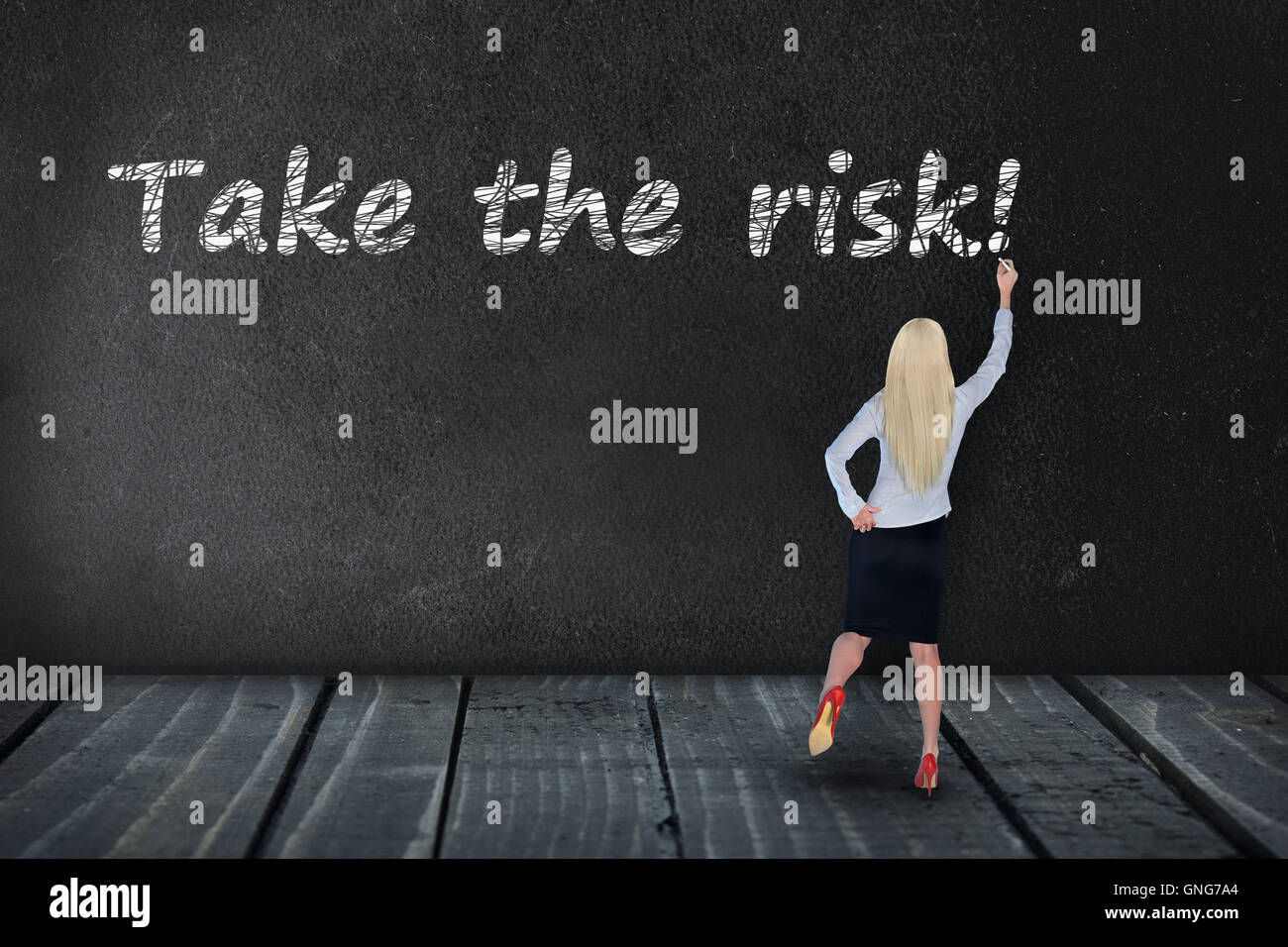 Take the risk text write on black board Stock Photo - Alamy
