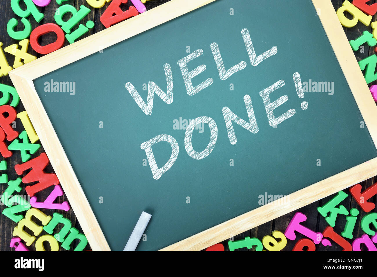 Well Done text on school board and magnetic letters Stock Photo - Alamy