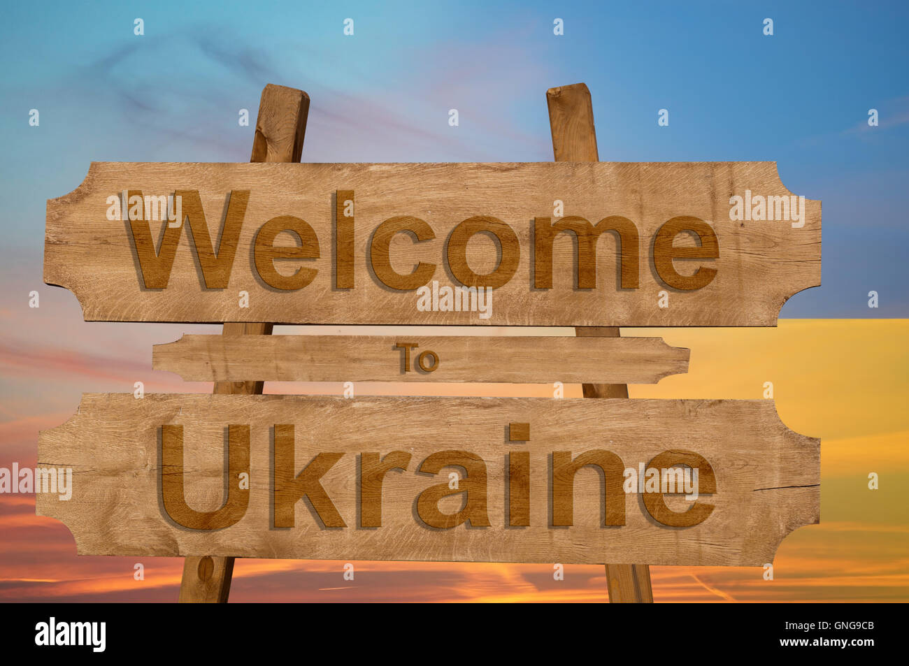 Welcome to Ukraine sing on wood background with blending national flag ...