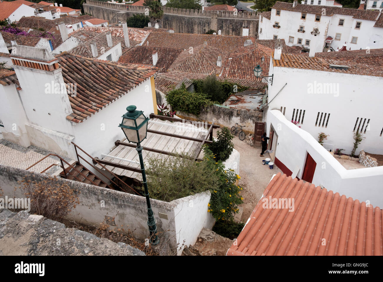 Traditional tiled rooves of the medieval walled town of Obidos ...