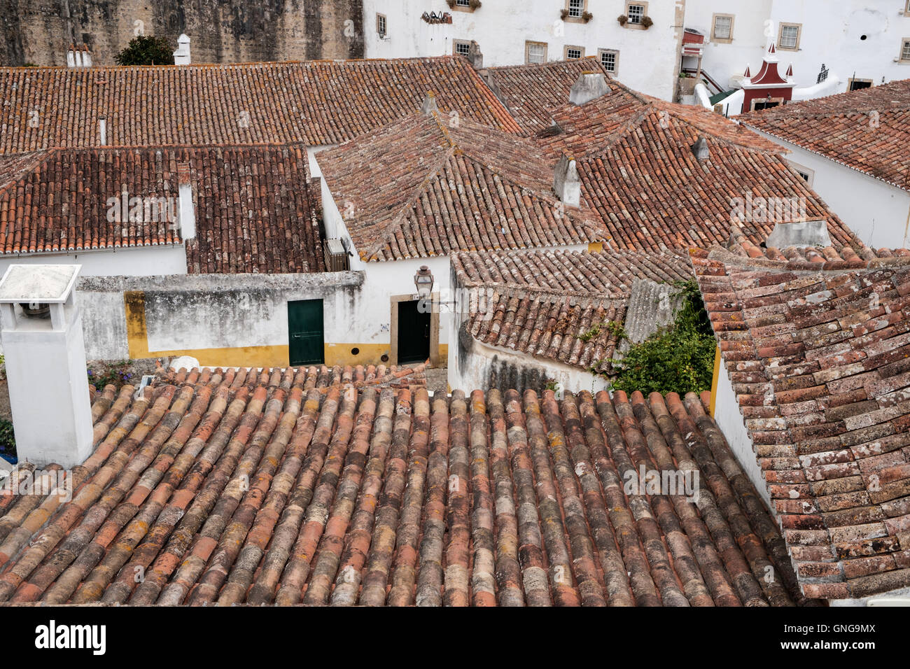 Traditional tiled rooves of the medieval walled town of Obidos ...