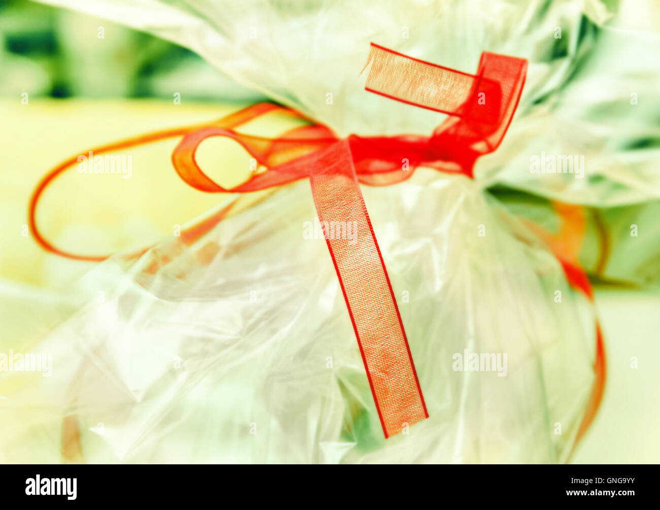 Red ribbon on gift box for present and surprise Stock Photo - Alamy