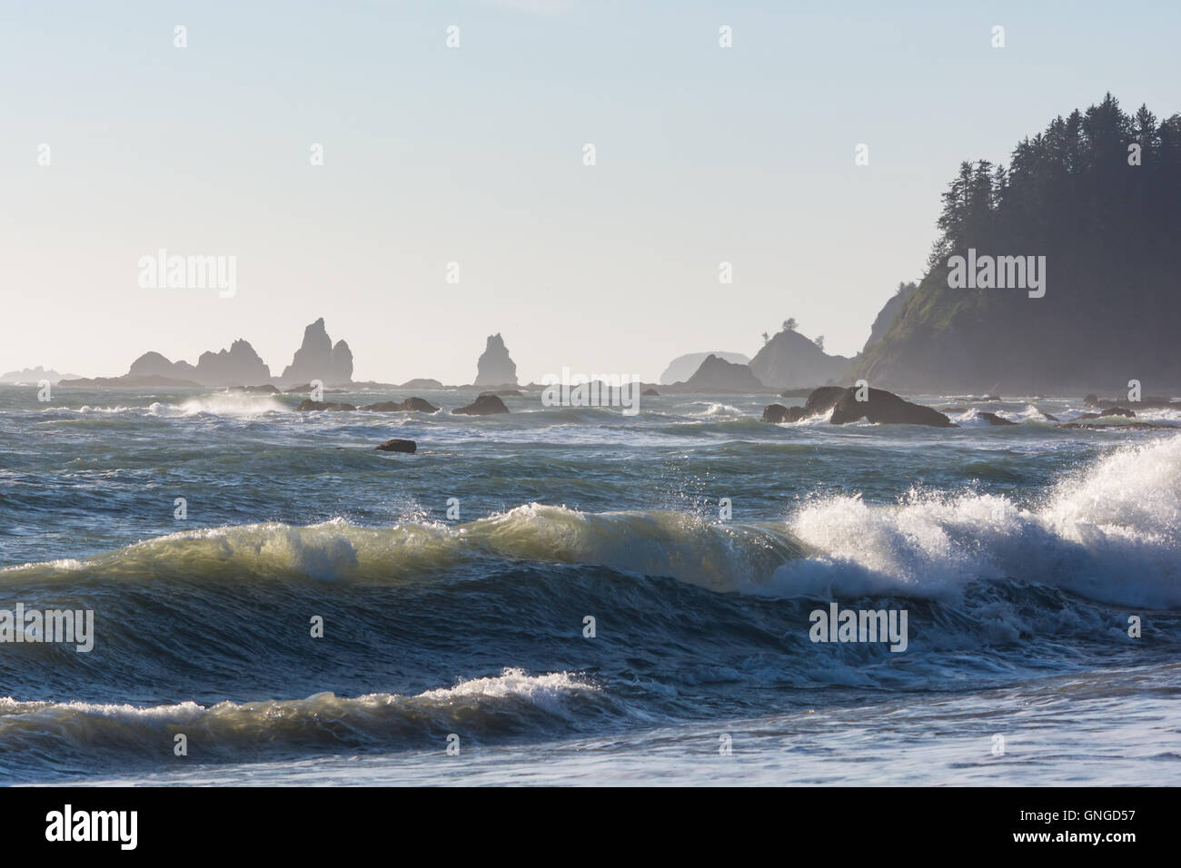 Waves crash against the rocks at sunset at Rialto Beach in Olympic ...