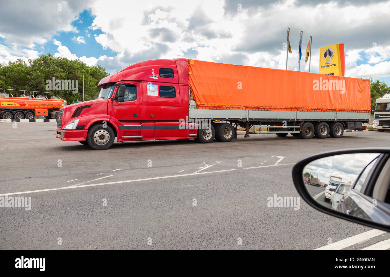 Big american truck on the highway. View from the car window Stock Photo ...