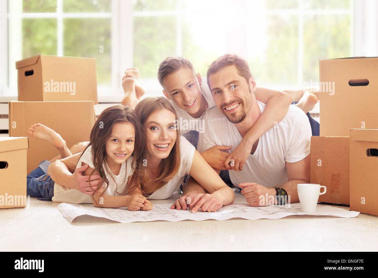 happy family in new home Stock Photo - Alamy
