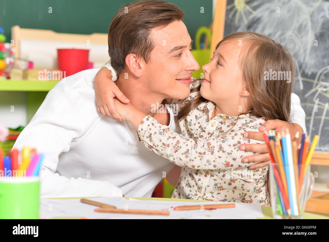 Father hugging his daughter Stock Photo - Alamy