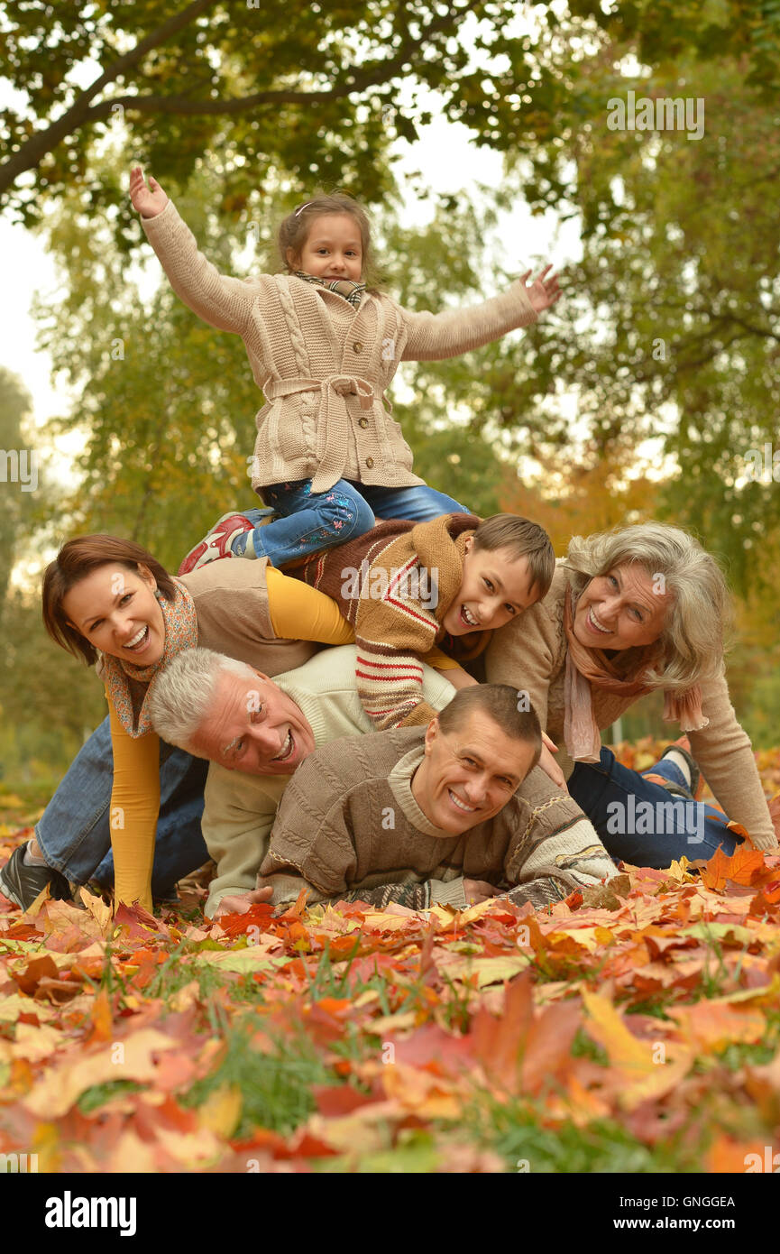 Family relaxing in autumn park Stock Photo - Alamy