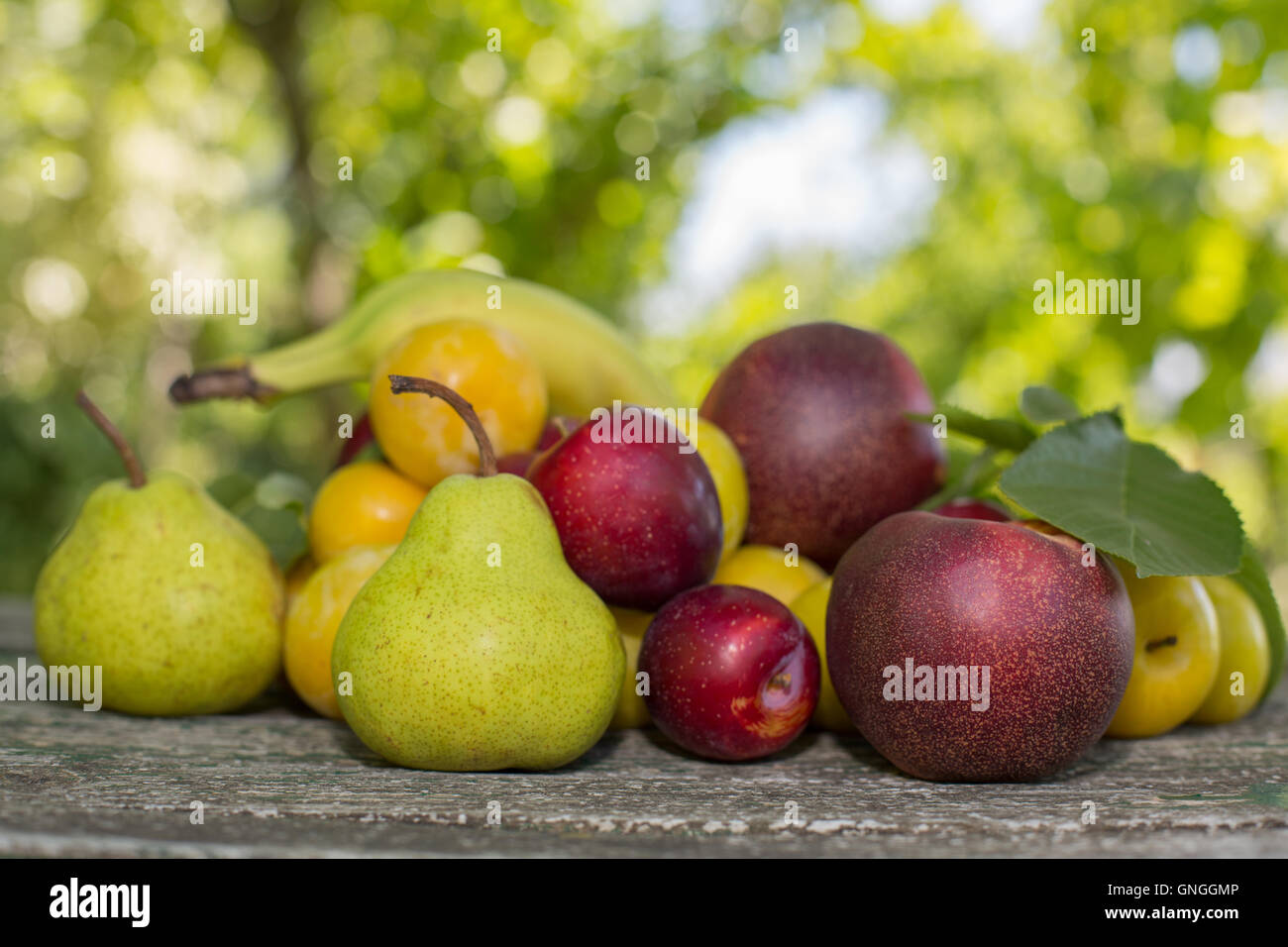 fruits in wooden table, outdoor Stock Photo - Alamy