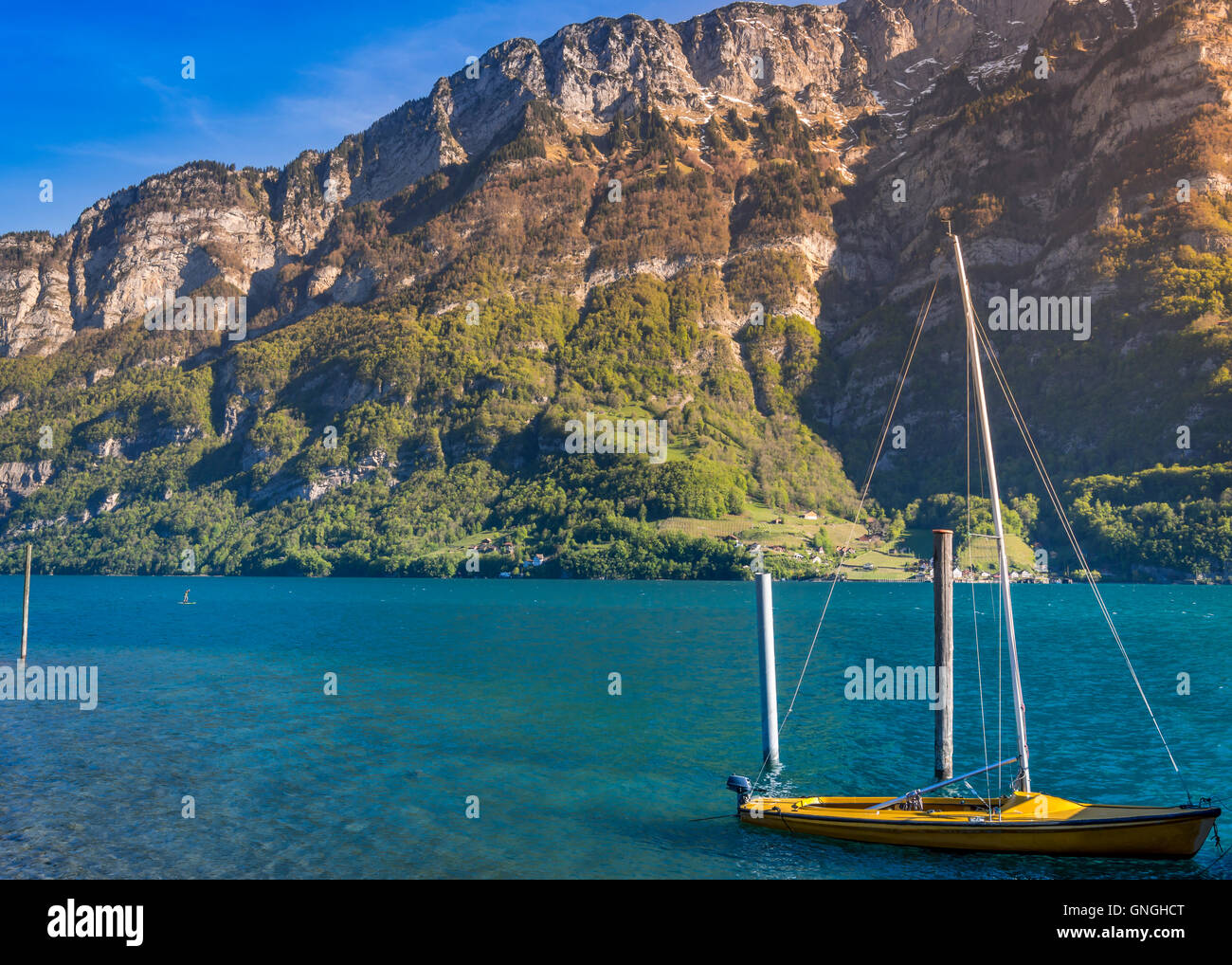 Boat with sails anchored on Walensee lake Stock Photo - Alamy