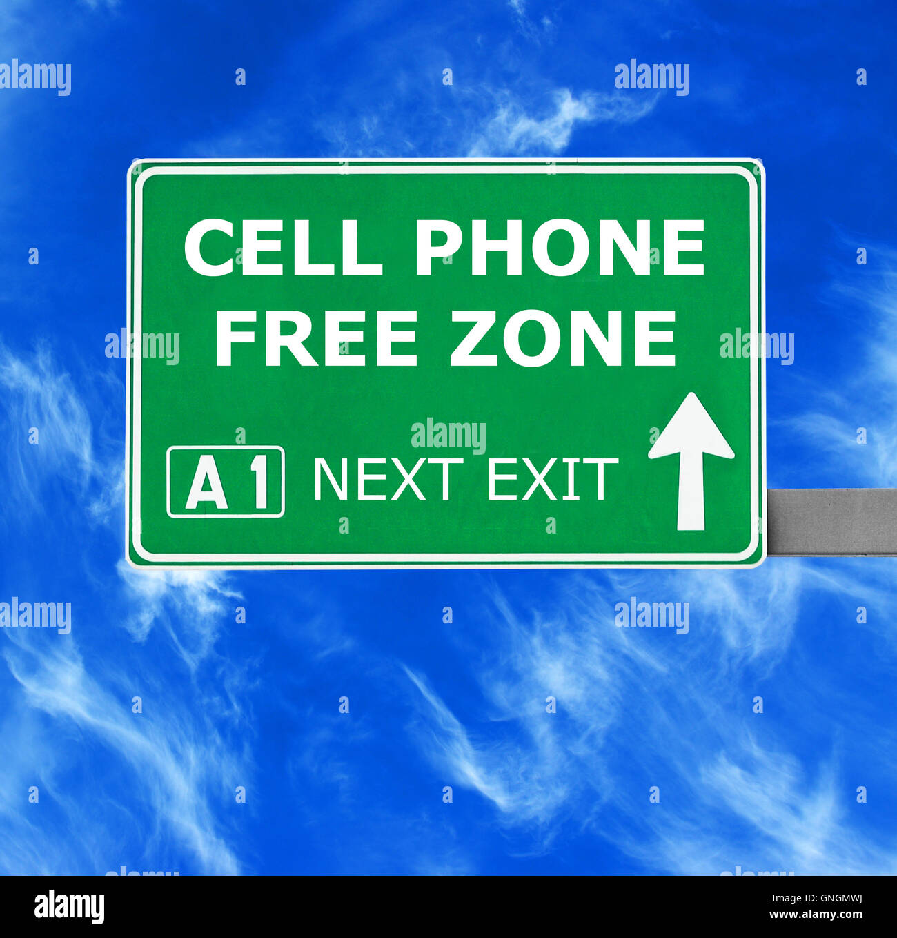 CELL PHONE FREE ZONE road sign against clear blue sky Stock Photo - Alamy