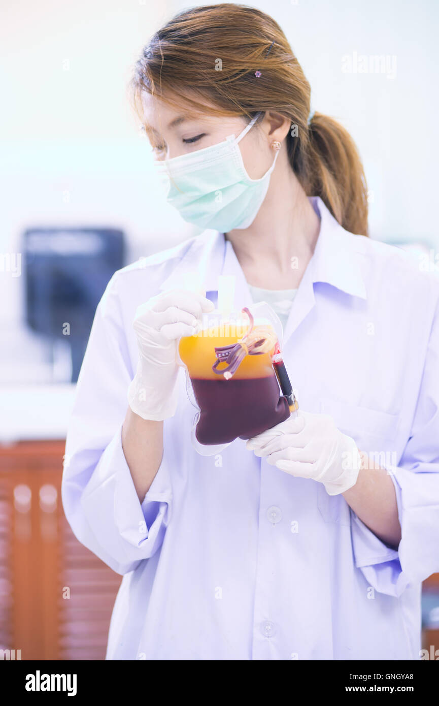 Bag of Blood in hand asian woman Doctor Stock Photo - Alamy