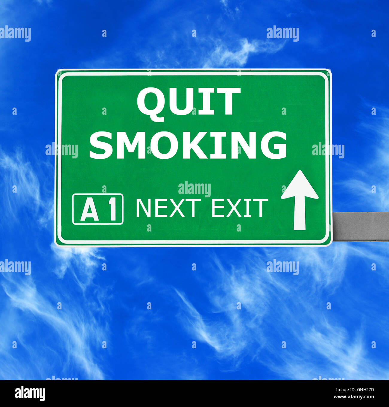 QUIT SMOKING road sign against clear blue sky Stock Photo - Alamy