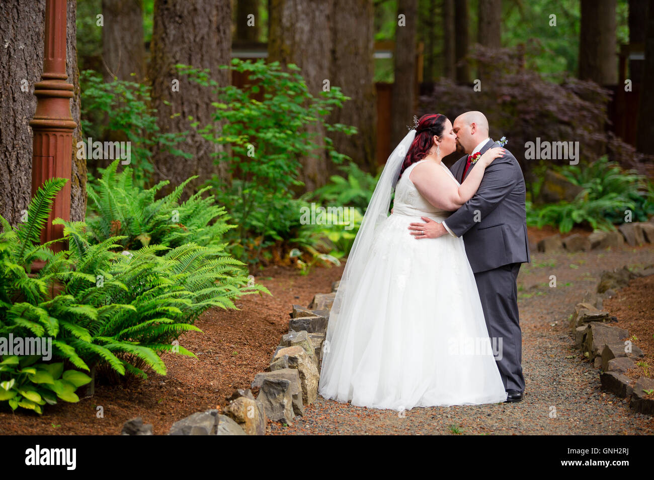 Bride and groom kissing Stock Photo - Alamy