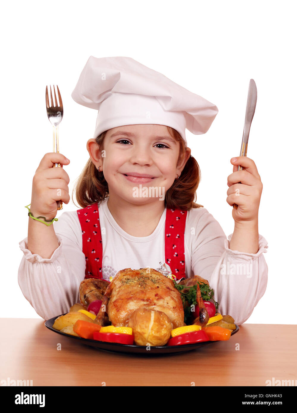 little girl cook with grilled chicken Stock Photo - Alamy