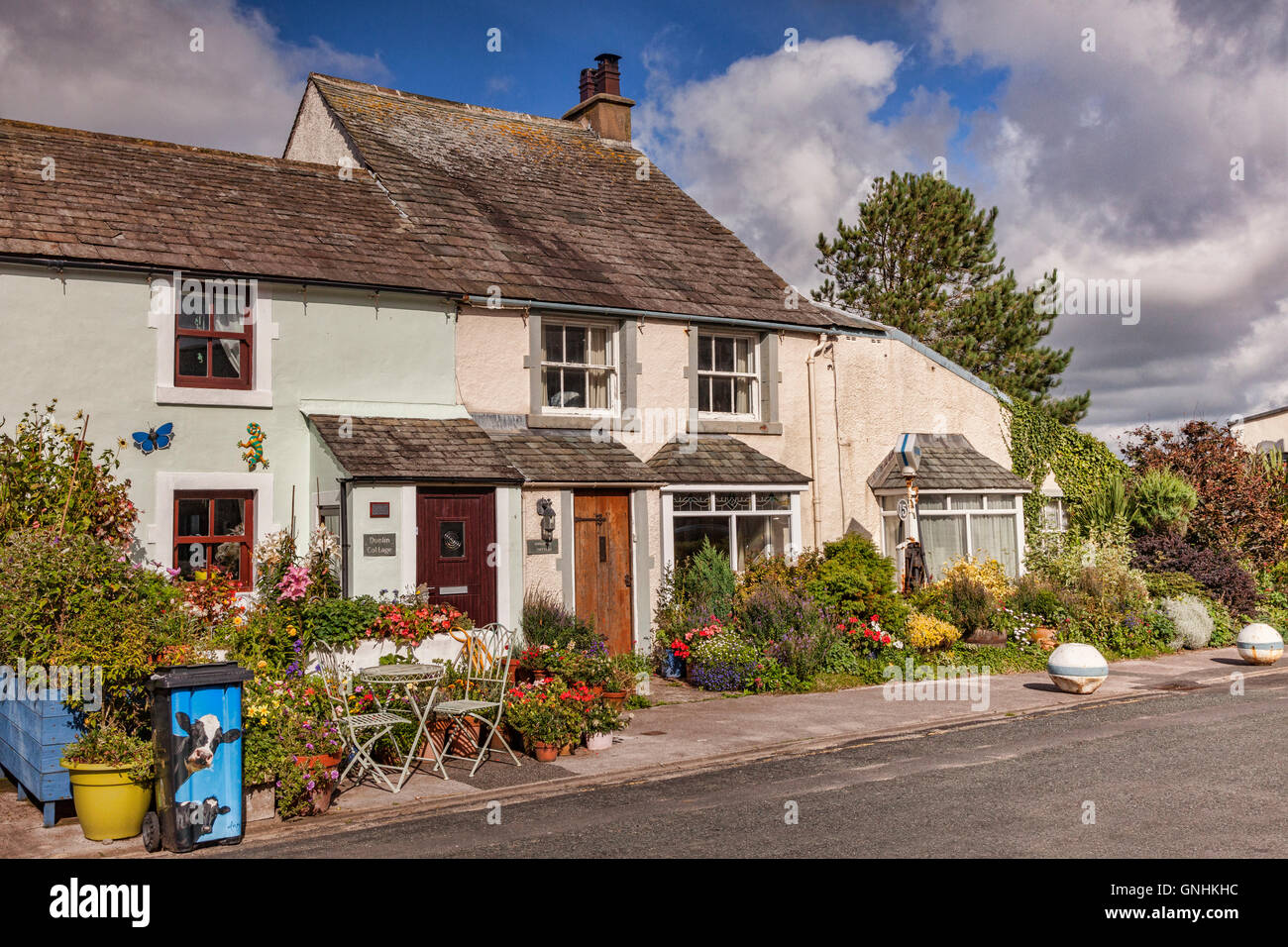 Cottages with lovely summer gardens and a decorated dustbin in Main ...