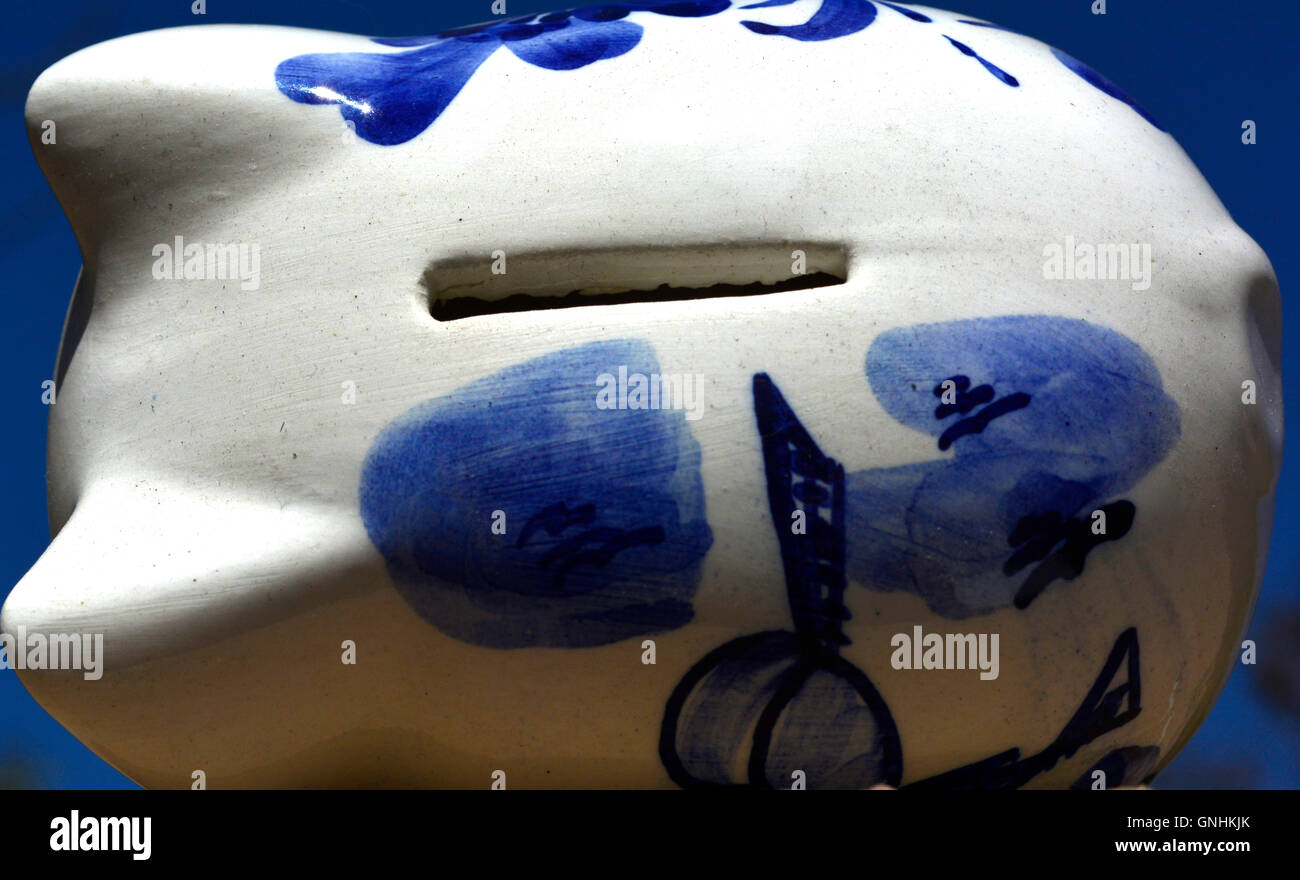 White en blue ceramic savings piggy bank top down view Stock Photo - Alamy