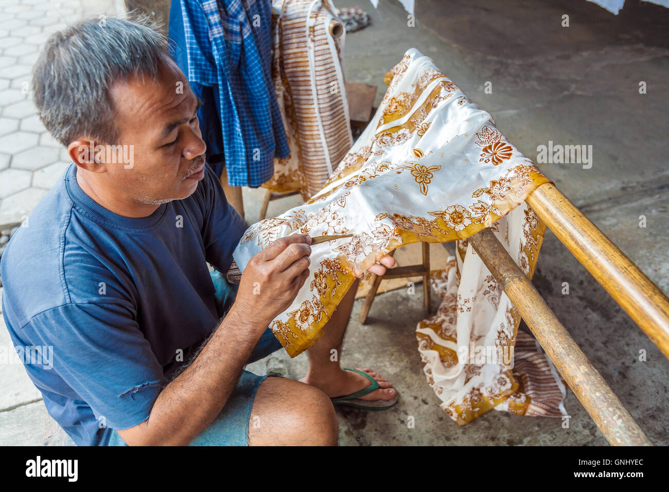 Man painting batik fabric hi-res stock photography and images - Alamy