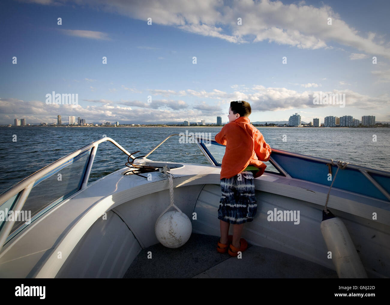 Boy standing on speedboat hi-res stock photography and images - Alamy