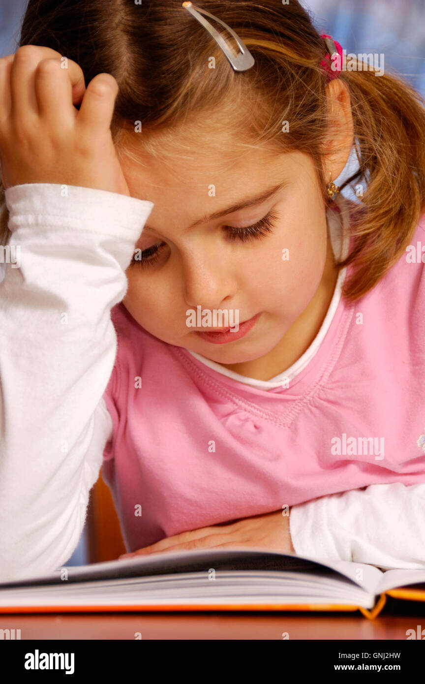 first grade girl doing homework Stock Photo - Alamy