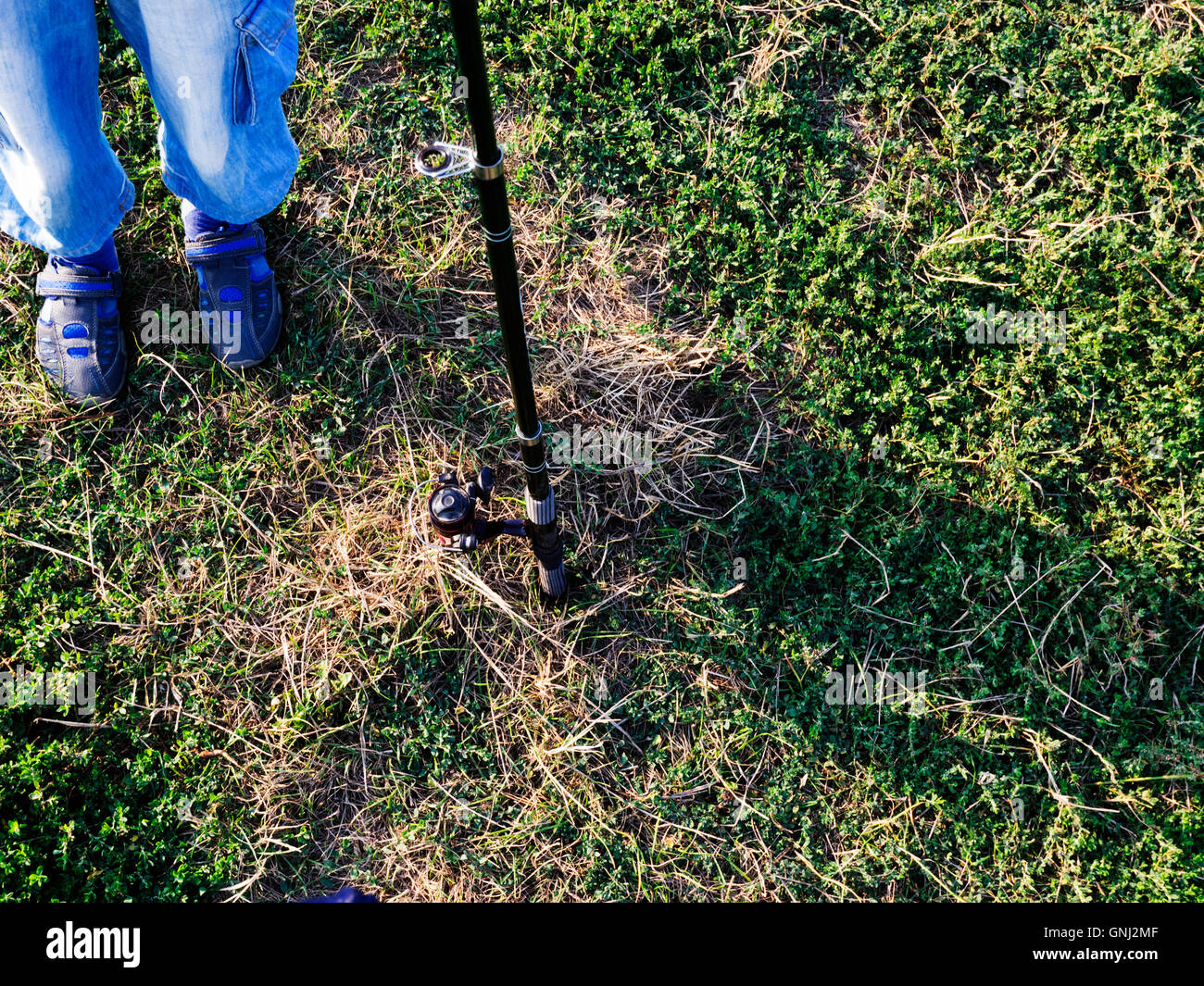boy holding a fishing rod Stock Photo - Alamy