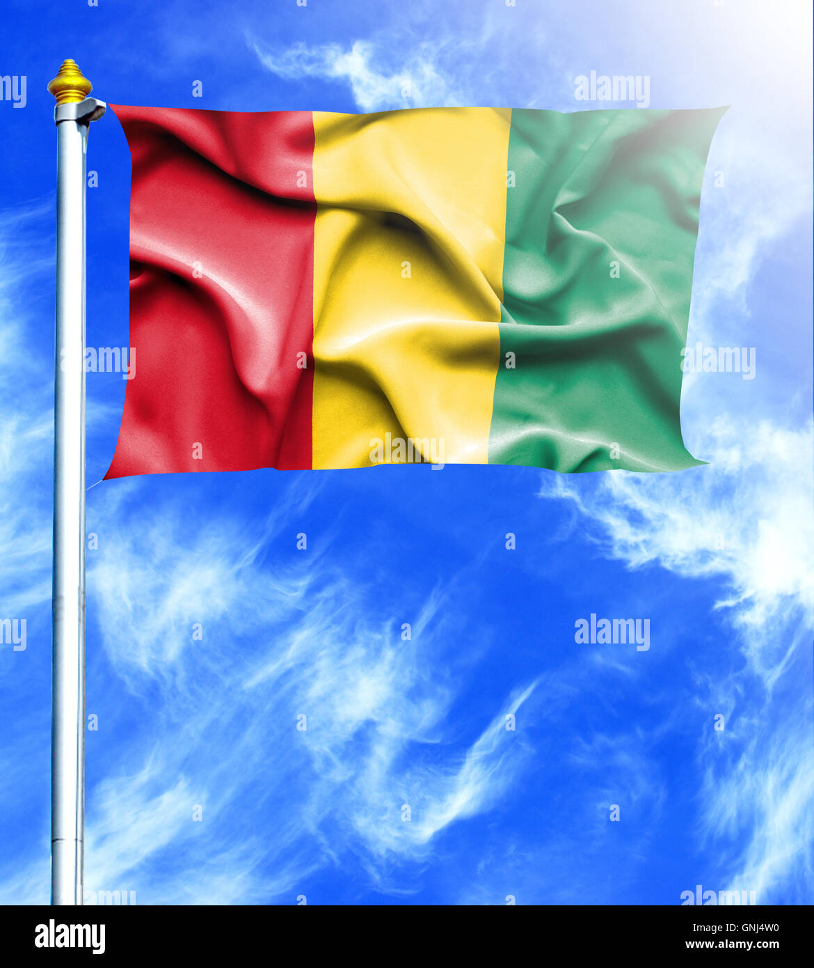 Blue sky and mast with hanged waving flag of Guinea Stock Photo - Alamy