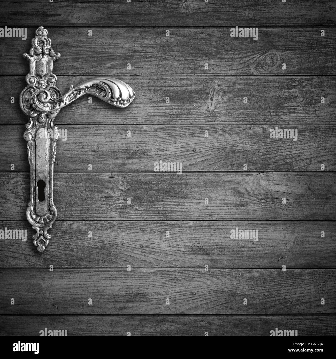 old handle in wooden door or vintage grey background Stock Photo - Alamy