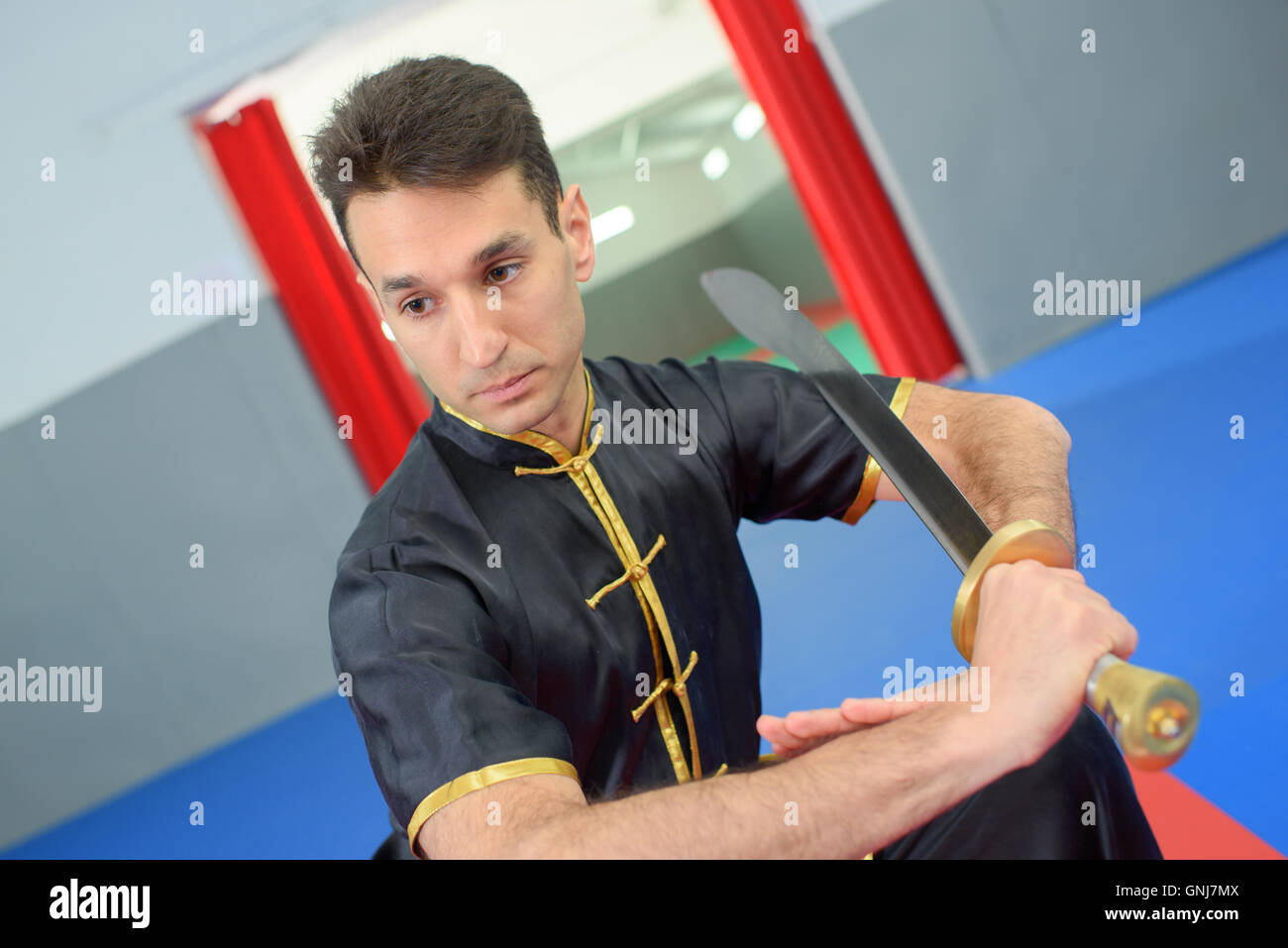 Sword and martial pose hi-res stock photography and images - Alamy