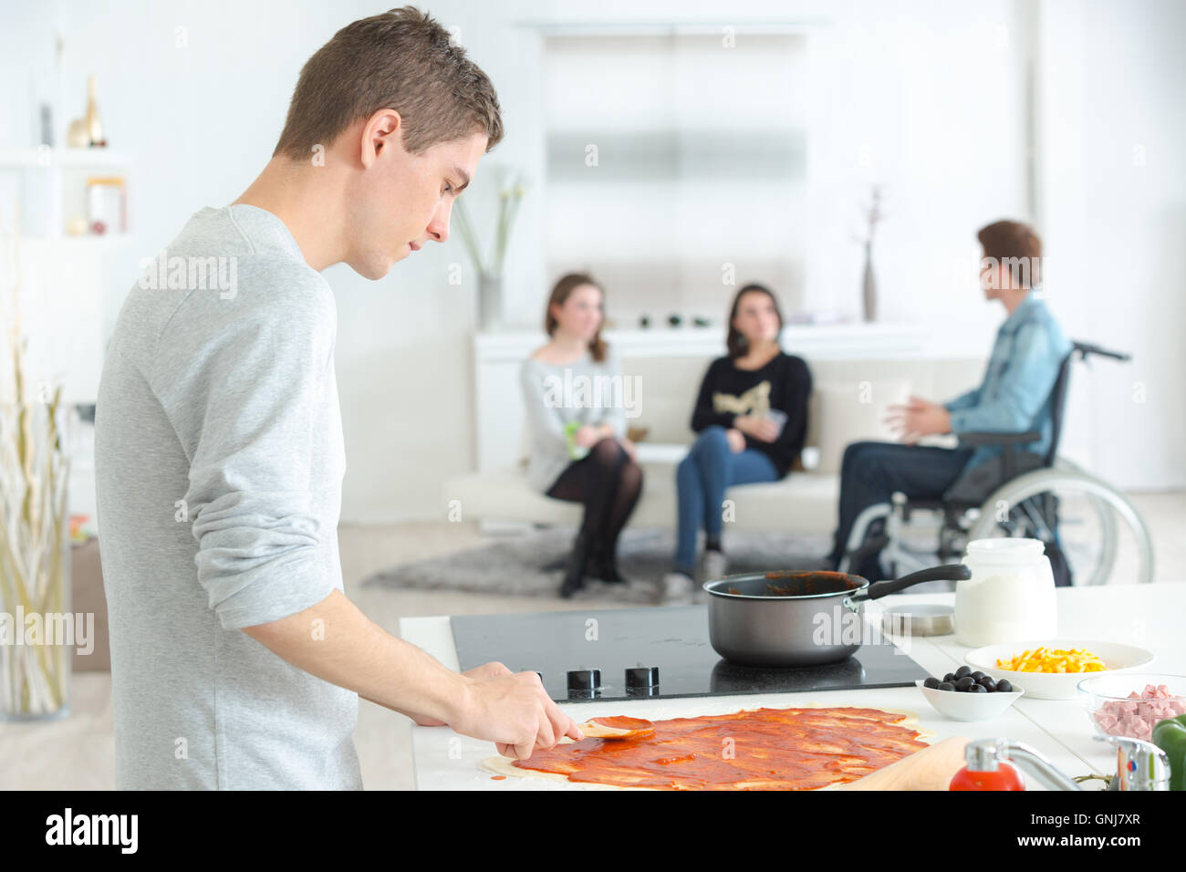 Cooking for a disabled friend Stock Photo - Alamy