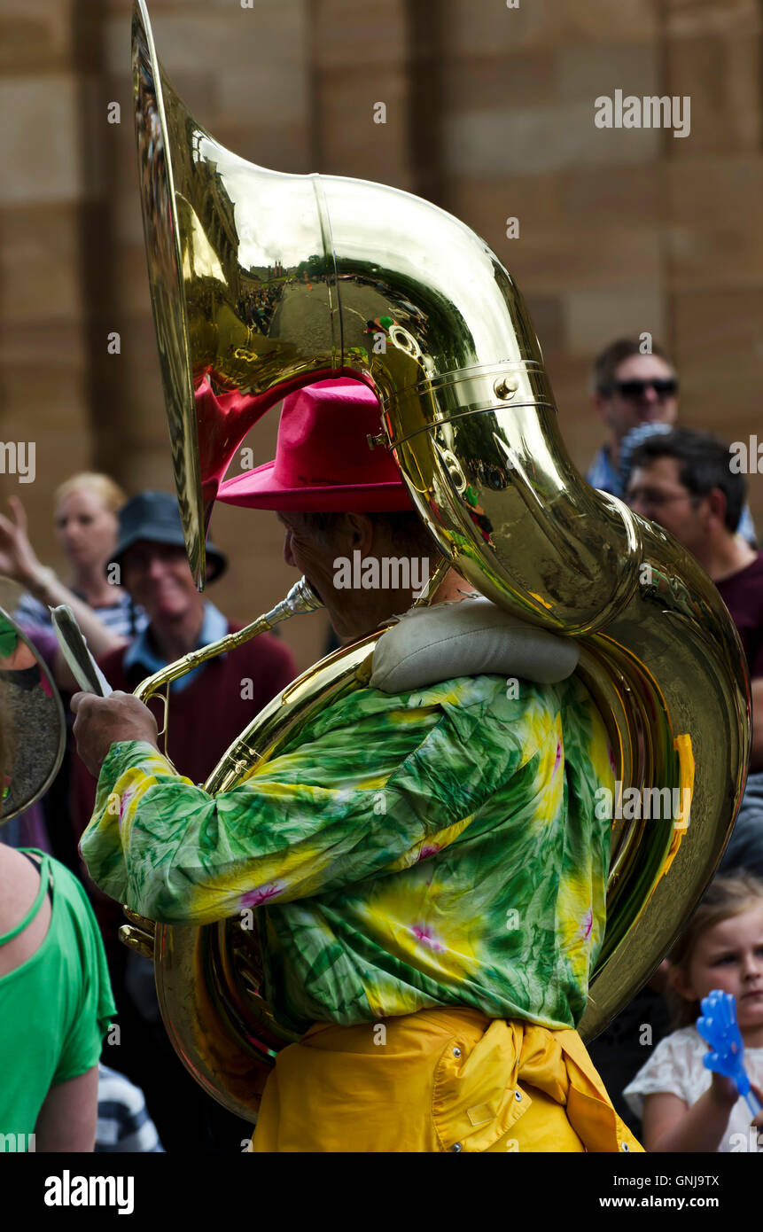 Man playing sousaphone in a marching horns band taking part in the ...