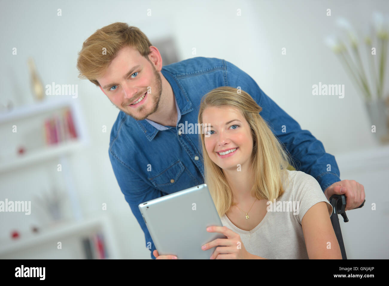 Disabled woman using a tablet computer Stock Photo - Alamy