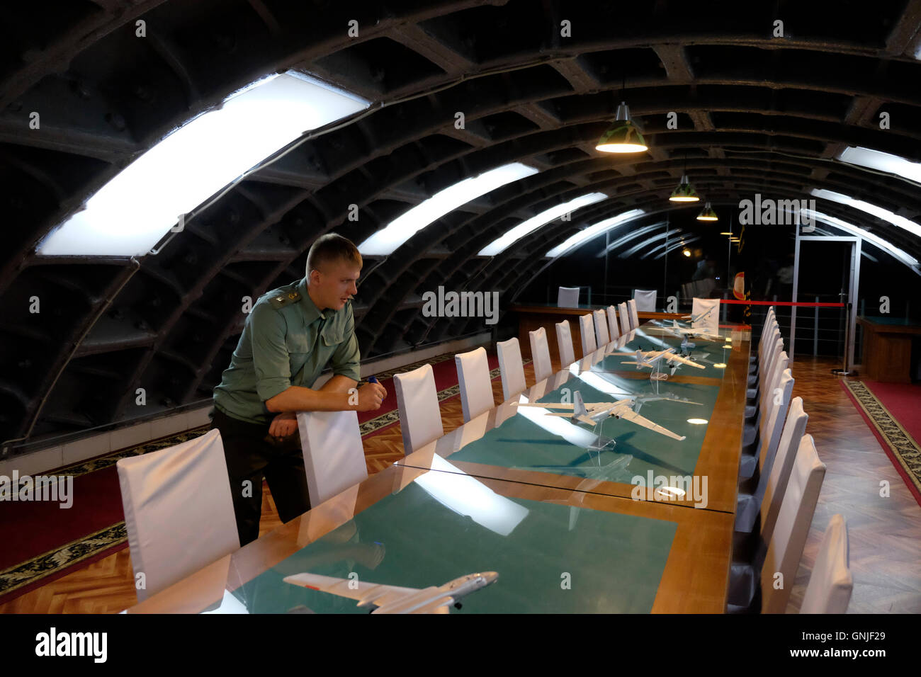 A uniformed Russian guide at the command chamber of the underground ...