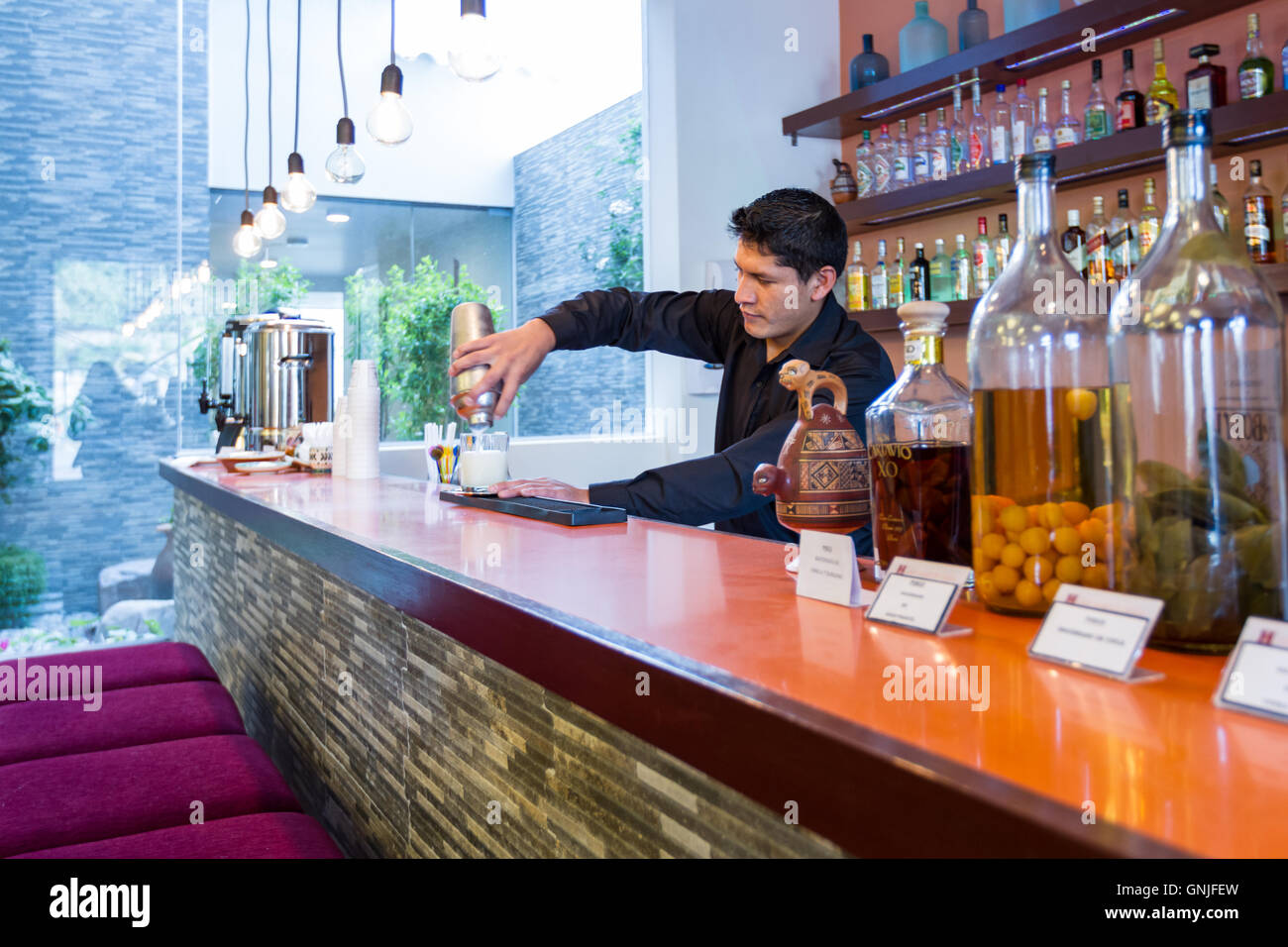 Cusco, Peru - May 13 : Bartender preparing a Cusco Sour in a beautiful ...