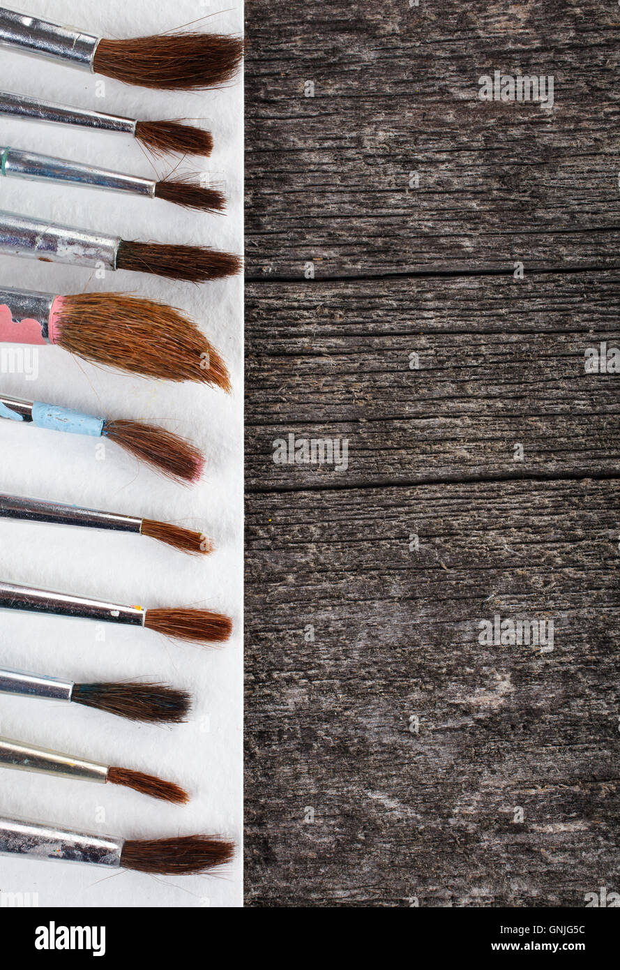 brushes for painting on white paper sheet Stock Photo - Alamy