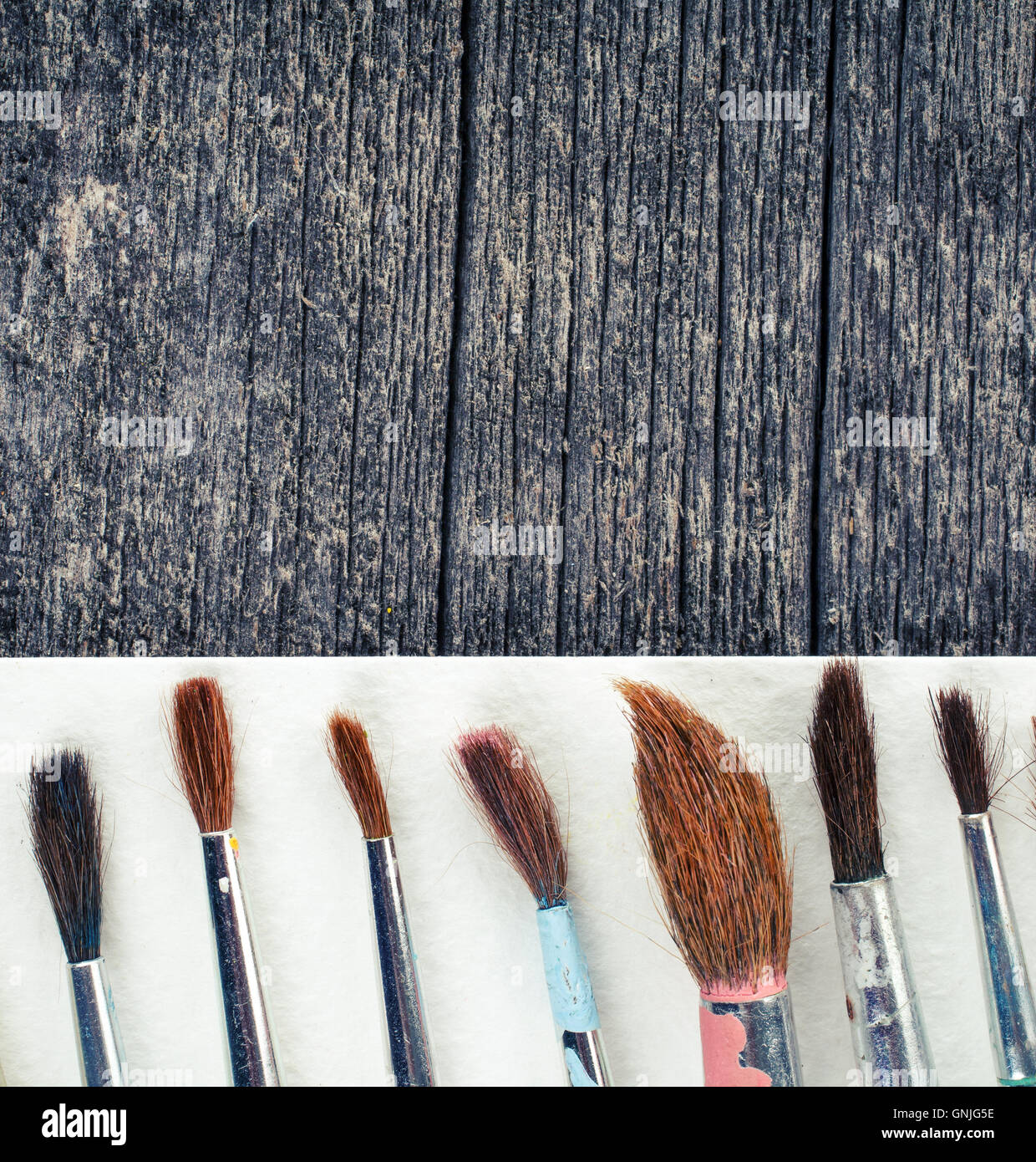 brushes for painting on white paper sheet Stock Photo - Alamy