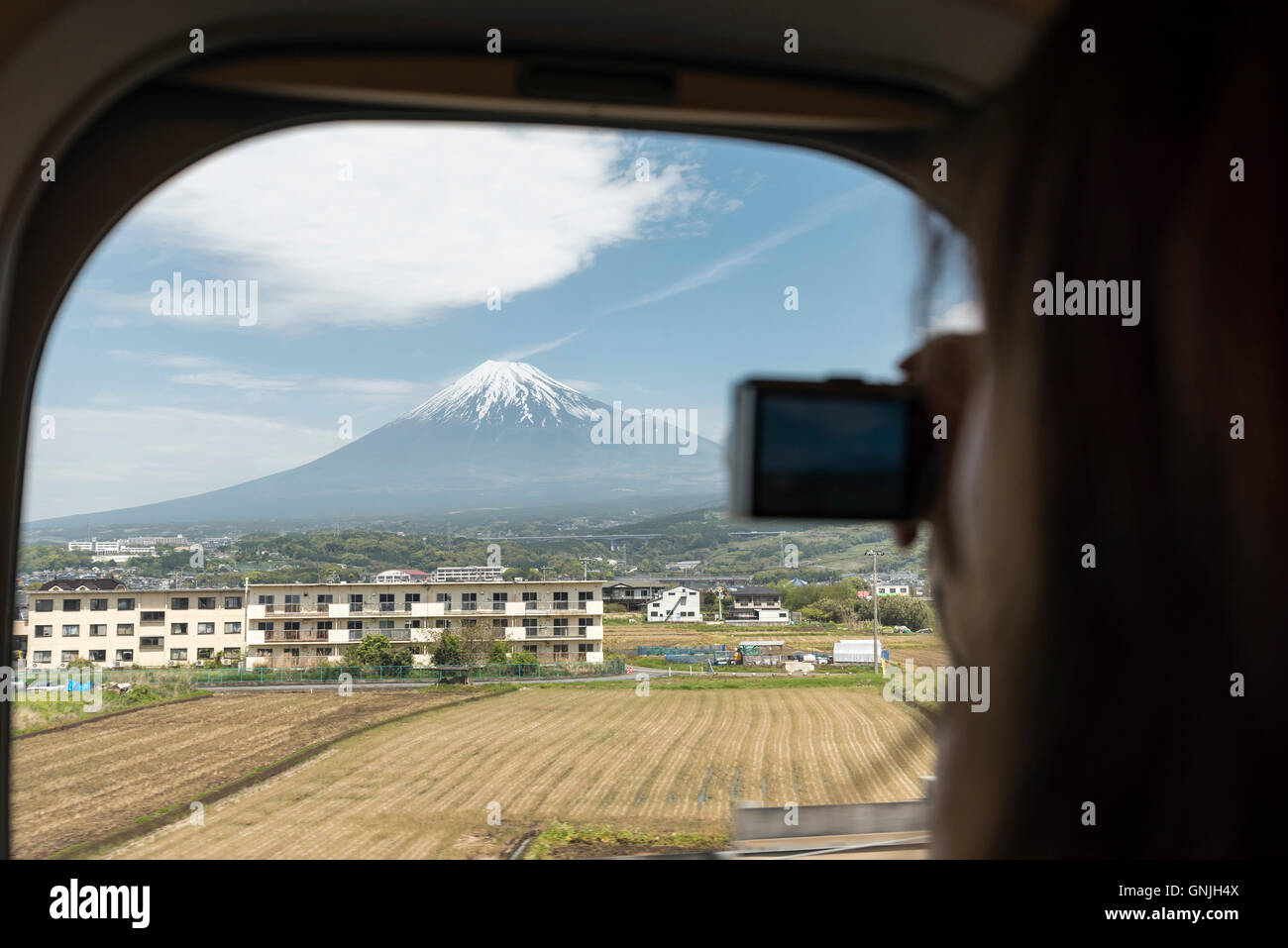 Tourist takes pictures of Mount Fuji from Shinkansen Bullet Train, Japan Stock Photo - Alamy